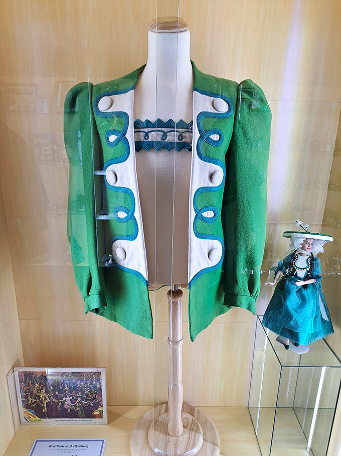 This authentic Emerald City townsman's jacket captures the film's vibrant aesthetic &ndash; a costume piece that brings movie magic to life.