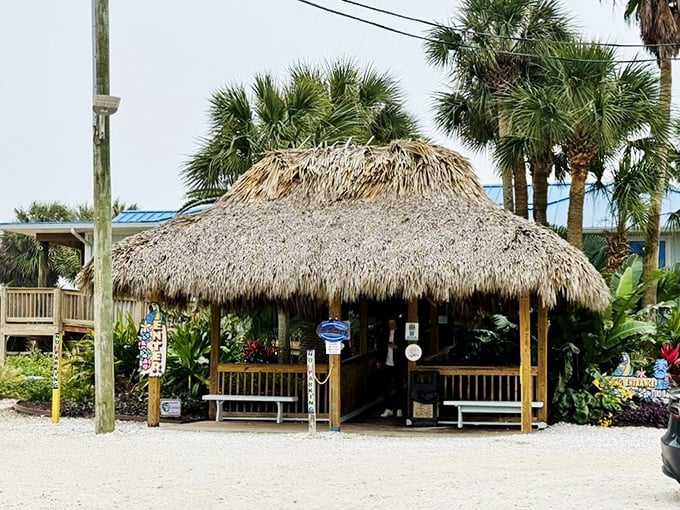 The thatched-roof tiki hut entrance says, "Leave your worries at the mainland." The best restaurants tell you what they're about before you even step inside.
