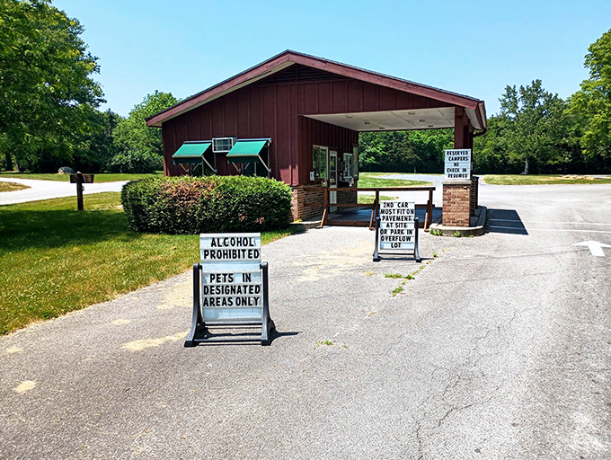 The park entrance stands as a friendly gatekeeper, its signs politely reminding you that real fun doesn't require Wi-Fi or alcohol.