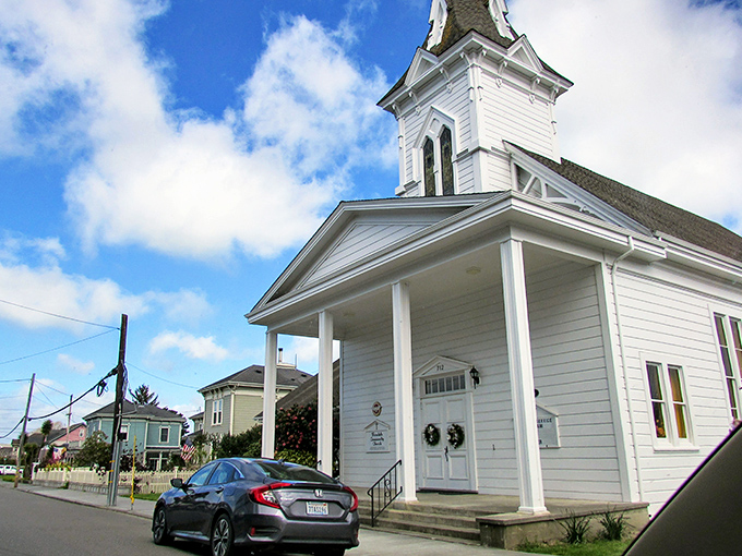 The Ferndale Community Church stands bright against the California sky, its simple white elegance a counterpoint to the town's more flamboyant Victorians.
