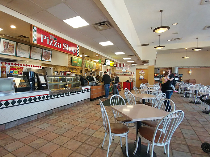 The food court offers a welcome respite for weary shoppers. Because bargain hunting burns calories, and those calories need immediate replacement.