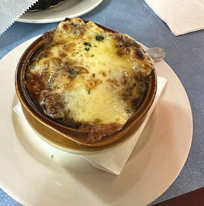 French onion soup bubbling with melted cheese creates the kind of soul-warming experience that cold days were invented for.
