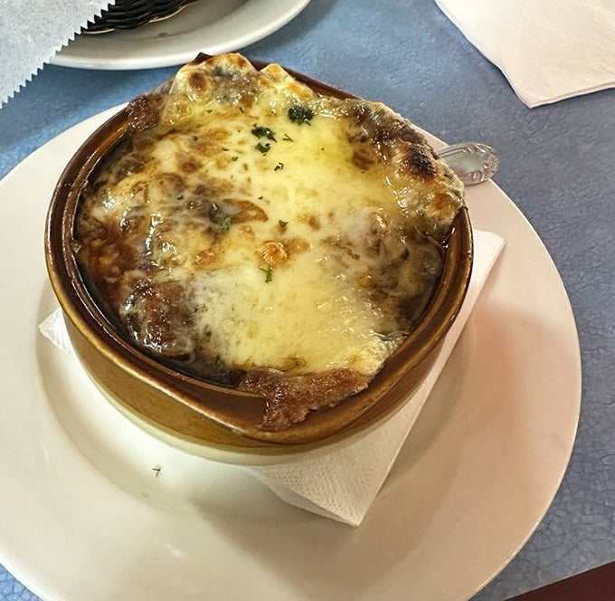 French onion soup with a cheese cap so perfectly browned it deserves its own Instagram account. Spoon-breaking satisfaction guaranteed.