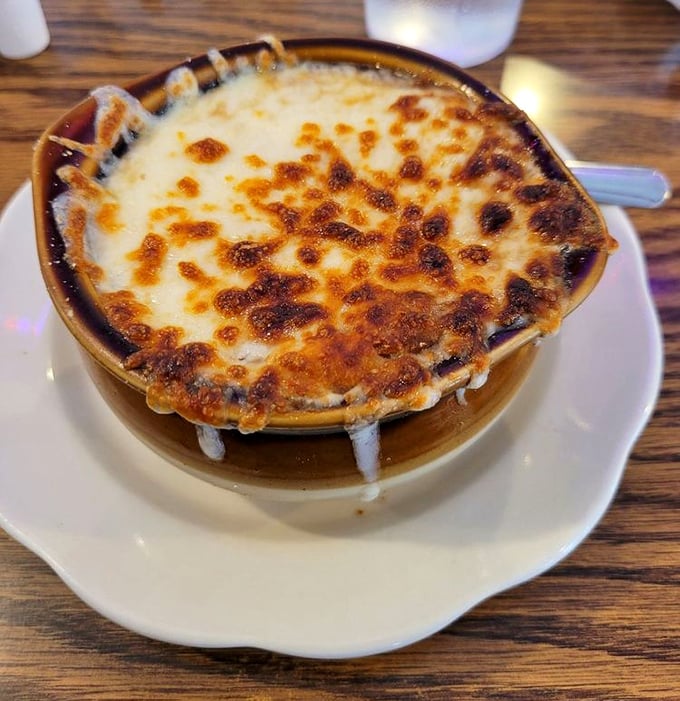 French onion soup with a cheese pull that deserves its own Olympic event &ndash; a bubbling cauldron of comfort that's worth the inevitable shirt stains.