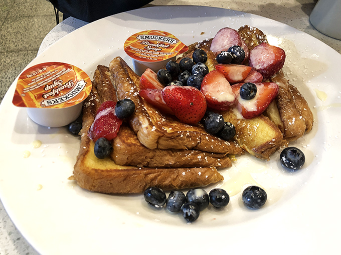 French toast adorned with fresh berries &ndash; proof that sometimes the simplest pleasures are the most effective antidotes to life's complications.