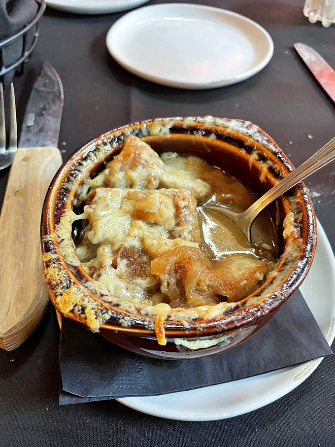 French onion soup that's had a proper education&mdash;bubbling cheese, rich broth, and bread that's soaked up all the right lessons.