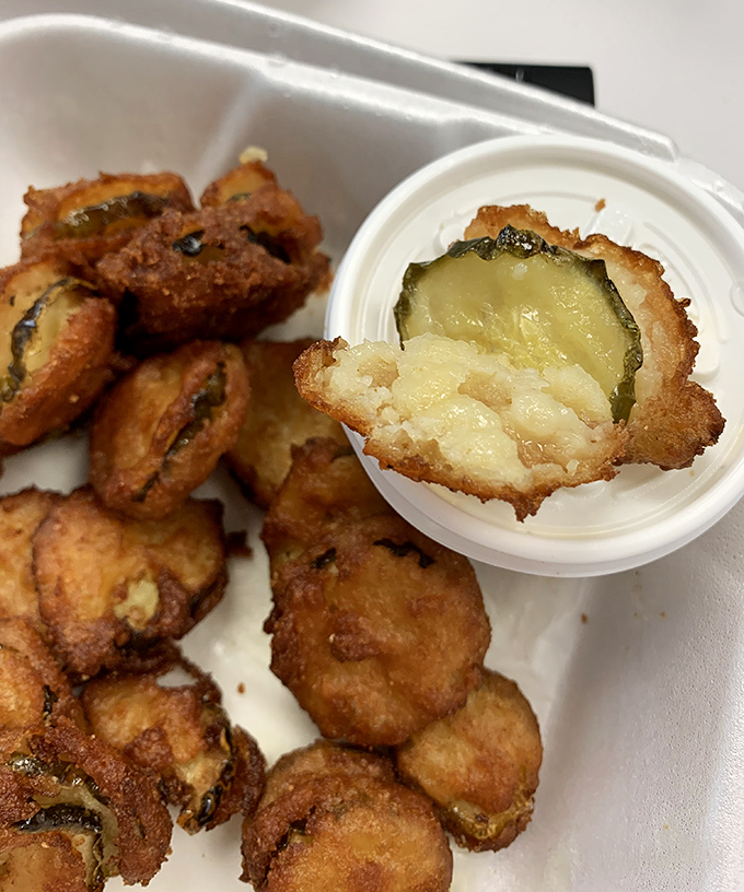 Fried mushrooms with a pickle center – proof that someone in the kitchen understands the importance of textural contrast and surprise.