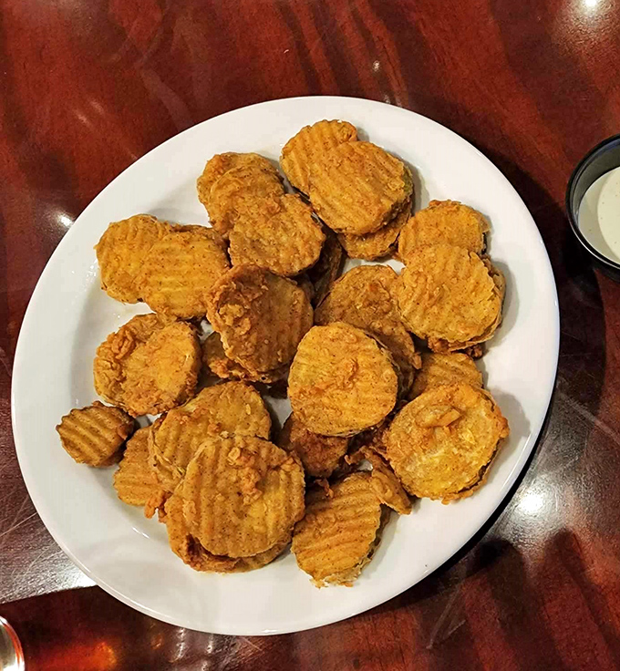 Fried pickles that achieve the impossible: maintaining their crunch while delivering that vinegary punch that makes your taste buds do a little dance.