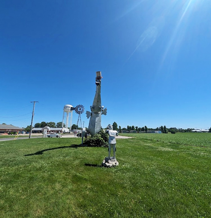 A classic American roadside scene: water tower, windmill, and fire-breathing dragon&mdash;one of these things is not like the others.