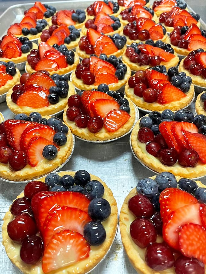 Fresh fruit tarts that look like they belong in a Parisian patisserie window, proving that sometimes beauty and flavor can peacefully coexist.