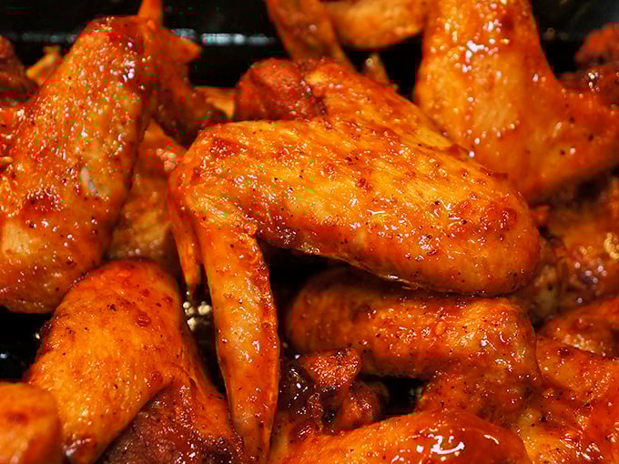 Glazed chicken wings glistening with sweet-spicy sauce&mdash;the kind that leave your fingers sticky and your taste buds begging for more.