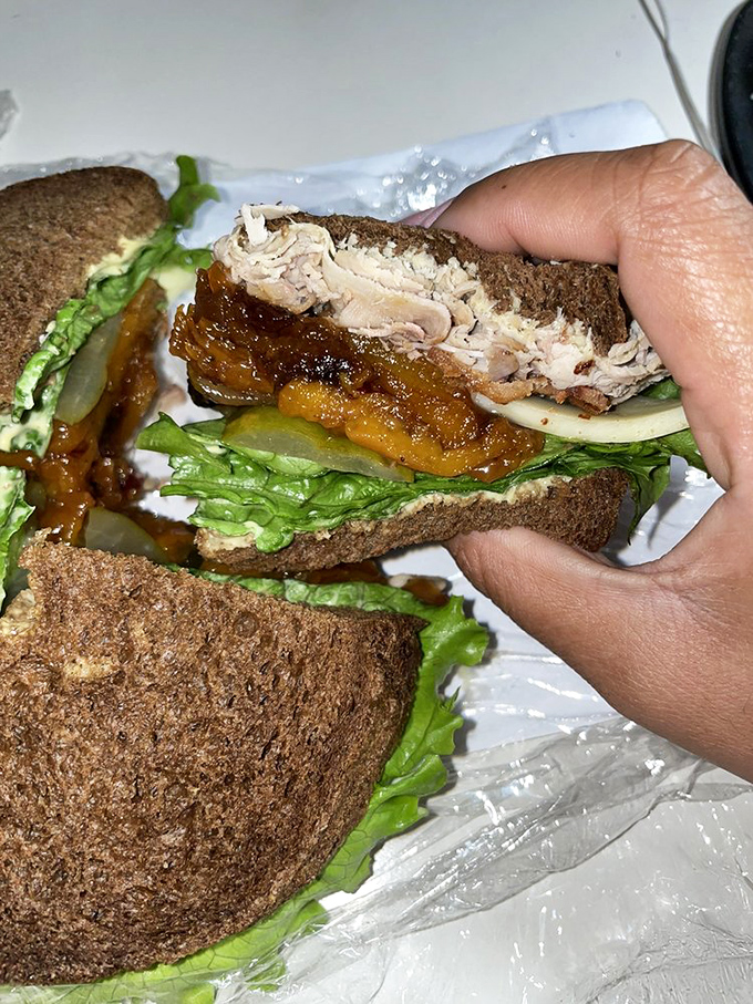 Whoever designed this sandwich deserves a Nobel Prize in lunch engineering. The cross-section reveals the careful architecture of flavor that awaits.