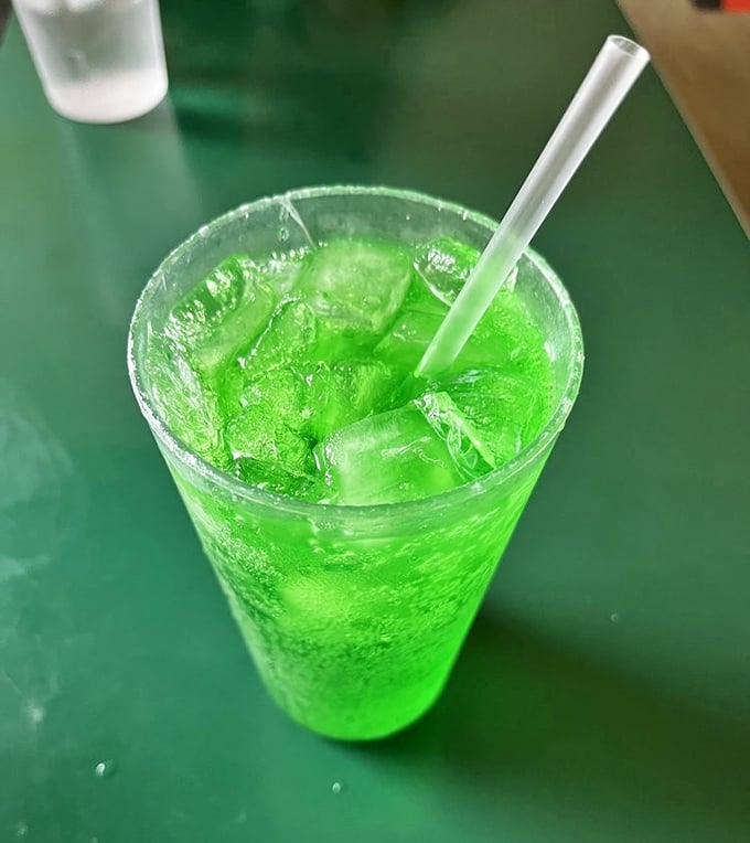 That electric green isn't a special effect&mdash;it's the legendary Green River soda, tasting like lime-flavored nostalgia in a glass that demands to be photographed.
