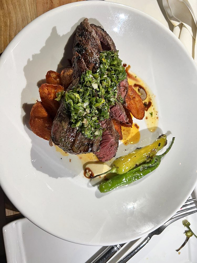 Perfectly grilled hanger steak with a vibrant herb topping. The kind of dish that makes you wonder why you ever bothered with other cuts of beef.