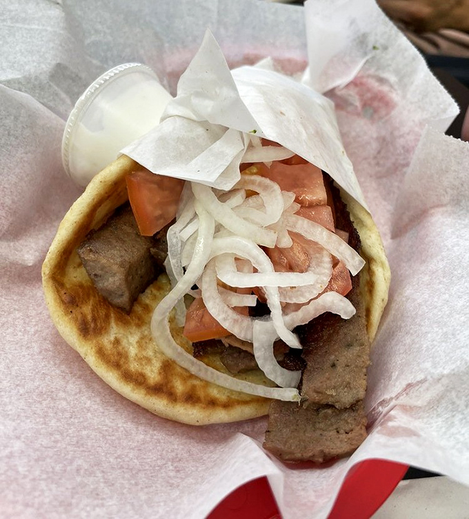 The gyro&mdash;where seasoned meat, fresh vegetables, and soft pita create a handheld masterpiece that transcends cultural boundaries and satisfies primal hunger.