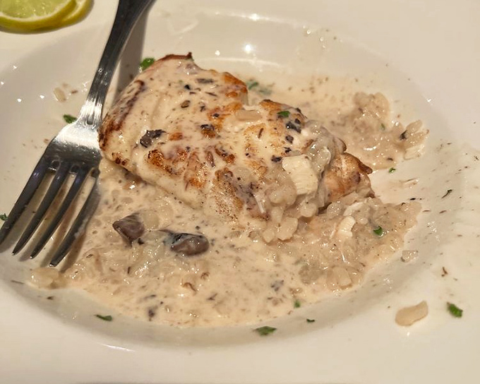 This halibut isn't just cooked&mdash;it's been elevated to art form status, resting on a bed of risotto like royalty on a throne.