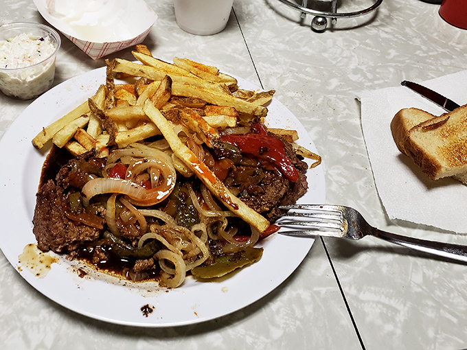 This hamburger steak with grilled onions isn't just a meal; it's a declaration that some comfort foods will never go out of style.