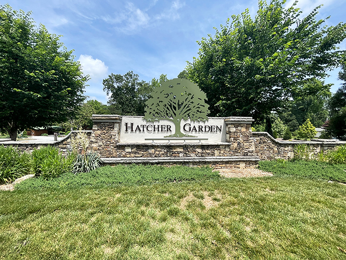 Hatcher Garden's stone entrance promises botanical delights beyond&mdash;a peaceful sanctuary where the only thing growing faster than the plants are the friendships.