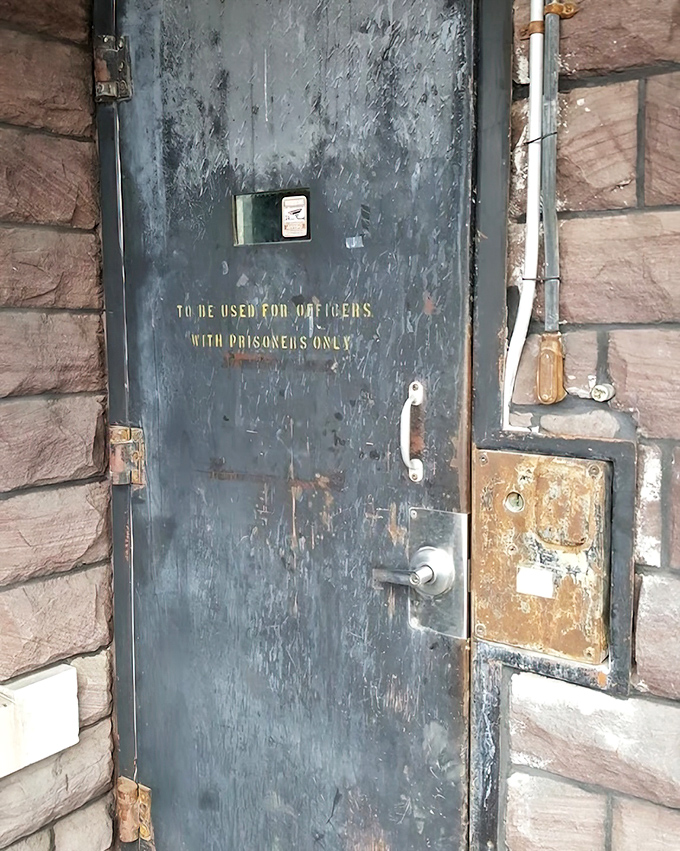 "To be used for officers with prisoners only"&mdash;this weathered door's stern warning hints at the strict protocols that governed every aspect of jail operations.