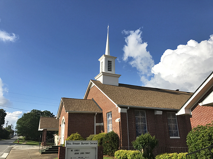 Hill Street Baptist Church's steeple reaches toward heaven, a spiritual landmark that anchors the community in faith and tradition.