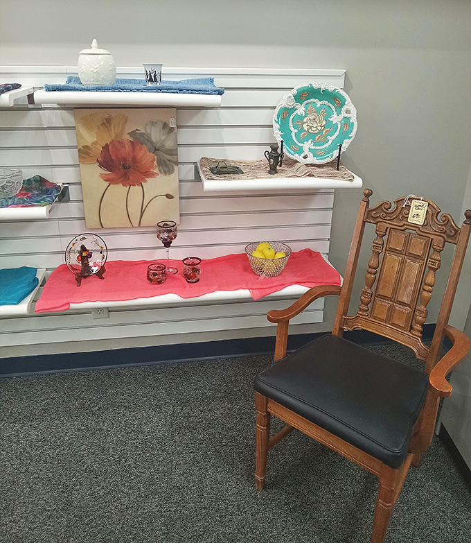 Artwork, decorative pieces, and quality furniture create themed displays that help shoppers envision these treasures in their own homes.