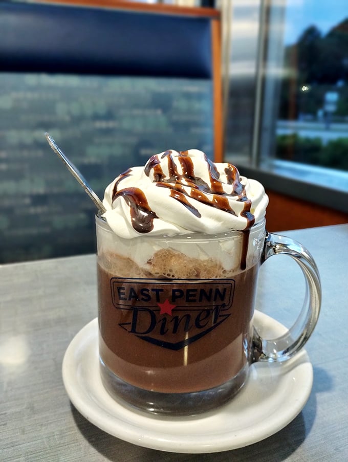 Hot chocolate elevated to an art form&mdash;whipped cream mountain, chocolate drizzle rivers, and that signature mug that says "you're home now."