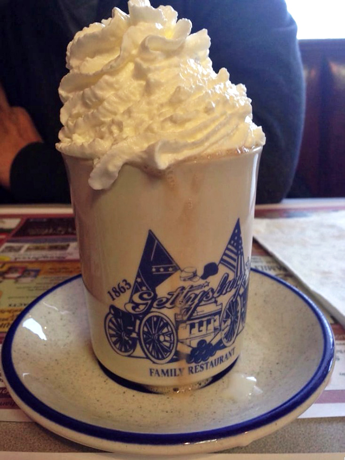 Hot chocolate that's more dessert than beverage, crowned with a cloud of whipped cream. The custom mug makes it taste even better &ndash; science can't explain why.