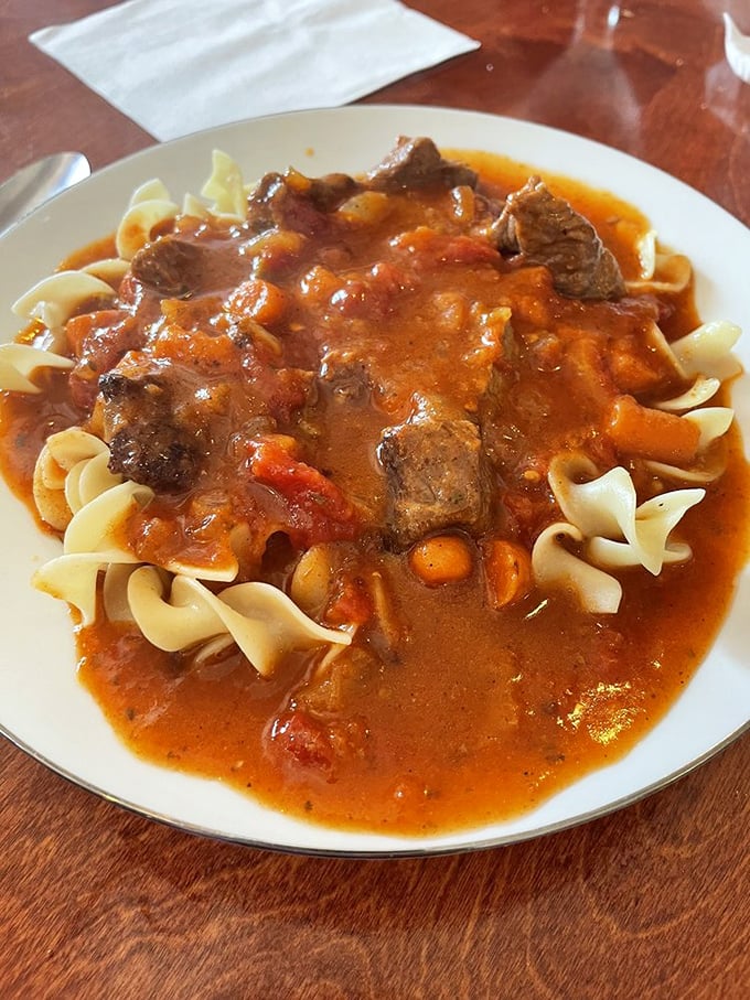 Hungarian goulash over egg noodles&mdash;where tender beef and paprika-rich sauce create the kind of meal that makes you cancel your evening plans.