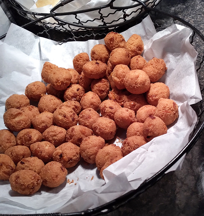 These hush puppies aren't just side dishes—they're golden orbs of cornmeal perfection that deserve their own fan club and commemorative t-shirt.