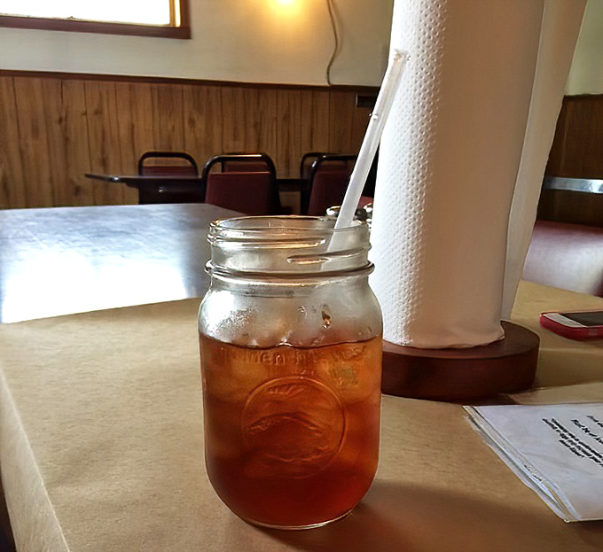 Sweet tea served in a Mason jar&mdash;because in a place this authentic, anything fancier would feel like putting a tuxedo on a fisherman.