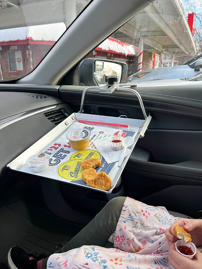 The ingenious window tray transforms your driver's side door into prime restaurant real estate&mdash;mid-century innovation that still feels revolutionary today.