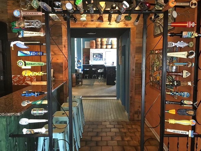 The beer tap entrance creates a playful portal between dining areas, showcasing local brews that pair perfectly with the day's catch.