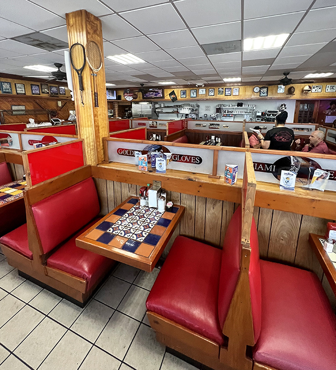 The diner's interior reveals thoughtful touches like checkerboard tables and sports memorabilia—creating neighborhoods within a neighborhood.