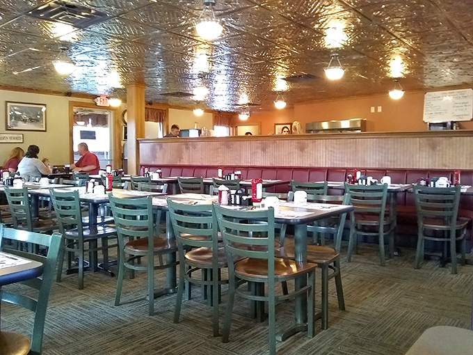 The dining room hums with conversation under that distinctive pressed-tin ceiling &ndash; a community gathering place where food and fellowship intertwine.
