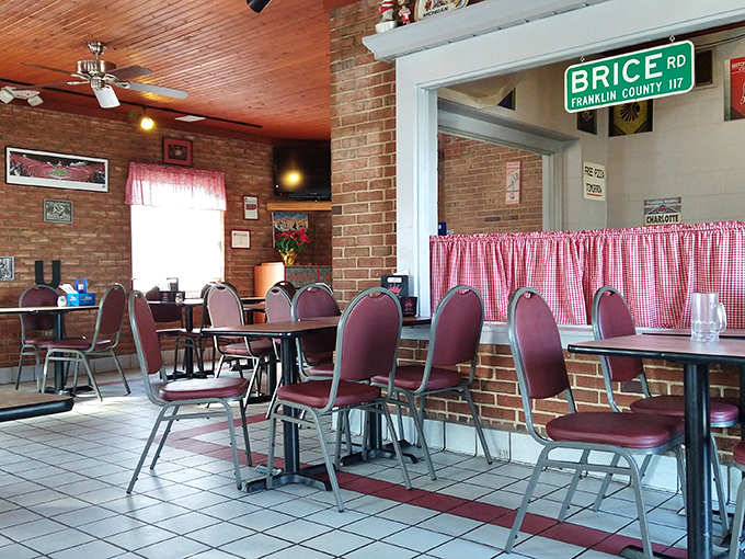 Red-checkered curtains and burgundy chairs&mdash;the dining room feels like it was designed by your Italian grandmother, in the best possible way.