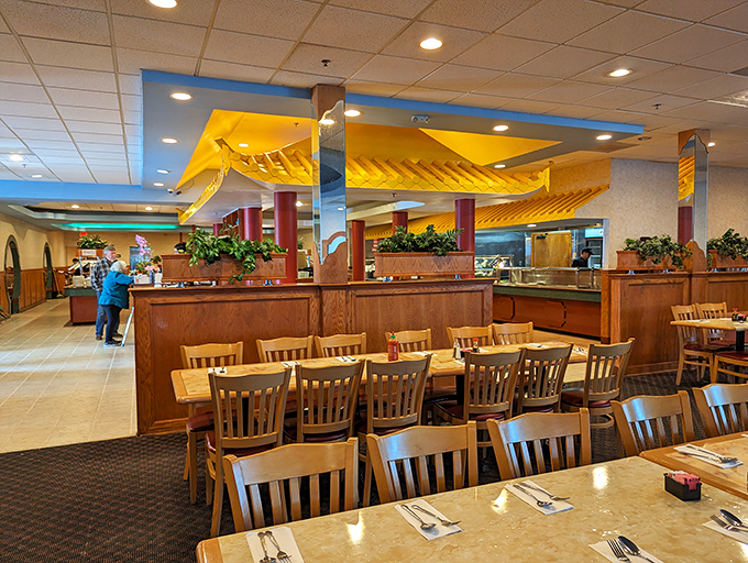 The spacious dining area with its yellow ceiling details creates an atmosphere where you can focus on what matters&mdash;multiple trips to those buffet stations.