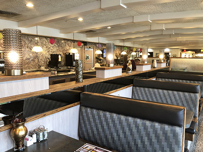 The interior design philosophy here is clear: comfortable booths, warm lighting, and just enough space between tables to keep your conversation about last night's TV finale private.