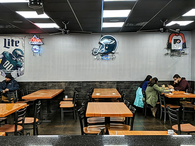 Philadelphia sports memorabilia watches over diners like guardian angels of good taste and local pride.
