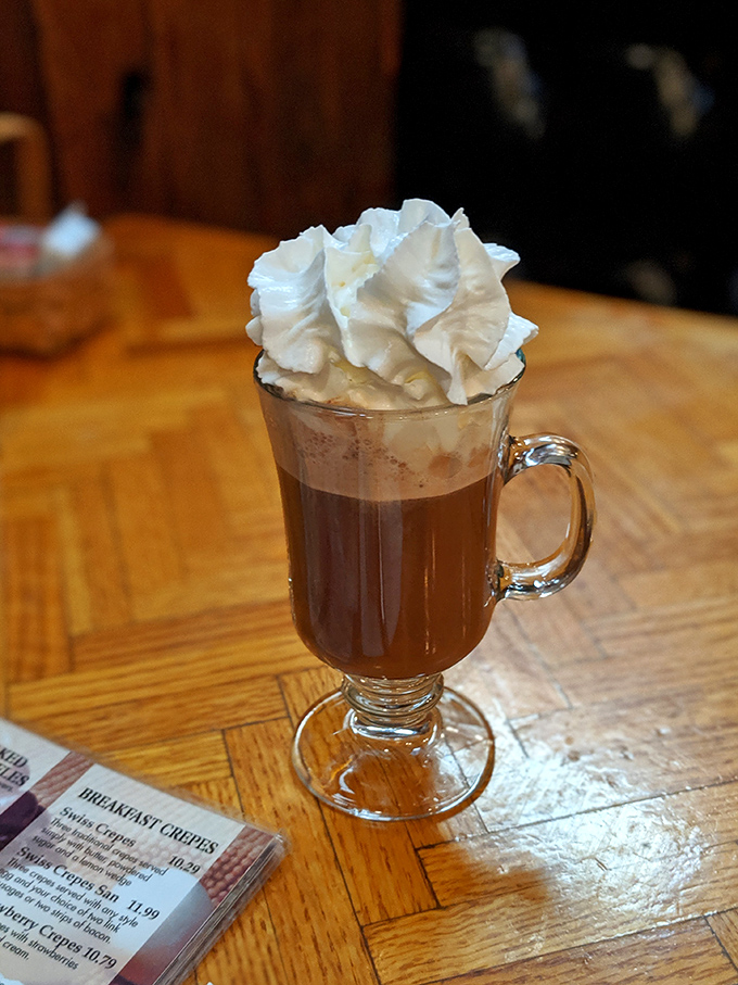 Hot chocolate elevated to art form&mdash;that whipped cream crown making you wonder if drinking dessert for breakfast is actually the smartest move.