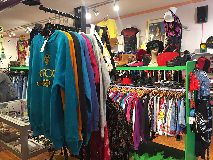 That teal Gucci sweatshirt isn't just clothing—it's a time capsule from when logos were king and shoulder pads had their own zip code.