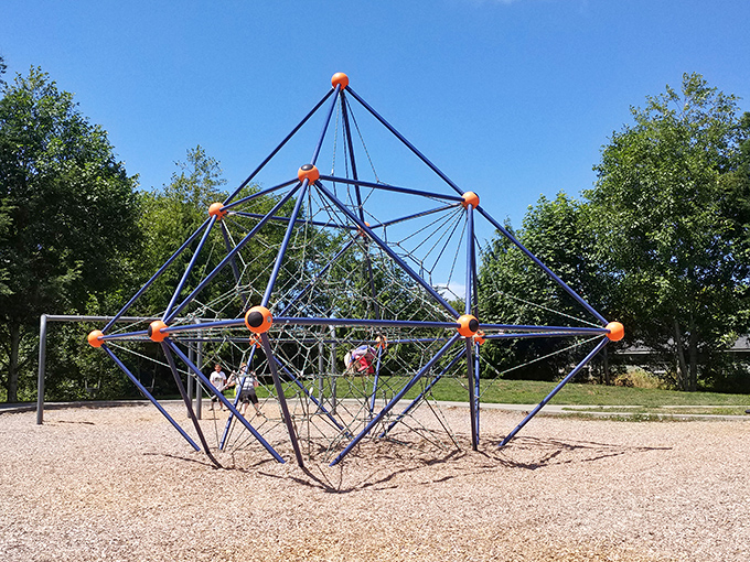 The geometric jungle gym stands like a mathematical puzzle waiting to be solved by little hands and adventurous spirits.