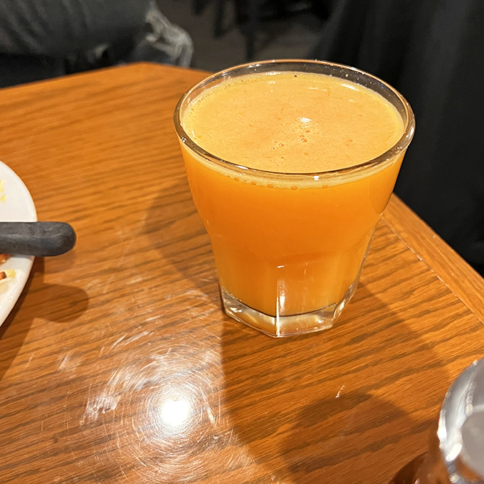 Fresh-squeezed orange juice that glows like liquid sunshine. One sip and you'll wonder why you ever settled for the stuff from a carton. 