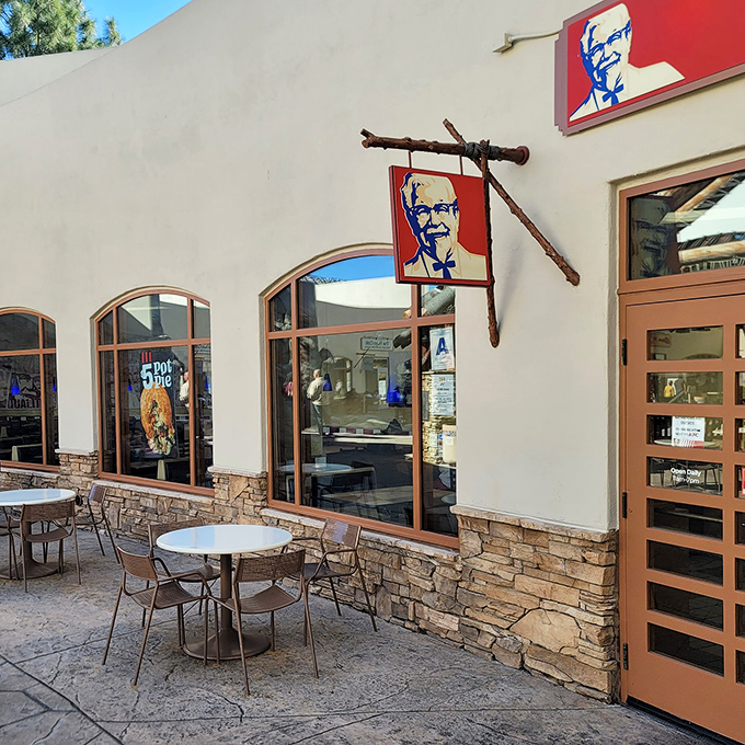 Colonel Sanders keeps watch over hungry shoppers at this KFC outpost. Those outdoor tables offer prime people-watching with your bucket of crispy comfort.