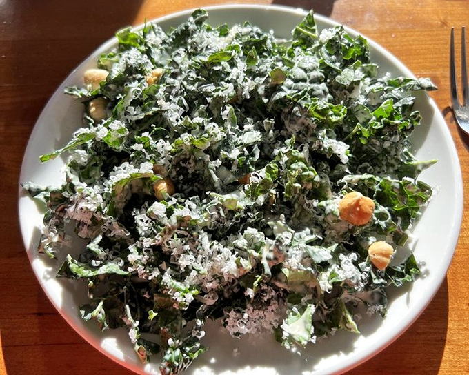 This kale Caesar salad has clearly been to finishing school—dressed impeccably with Parmesan snowfall and perfect croutons for textural intrigue.