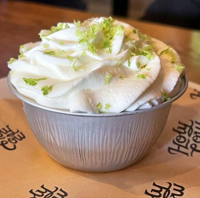 Key lime pie arrives like a creamy cloud of citrus salvation, the perfect sweet ending to all that savory glory.
