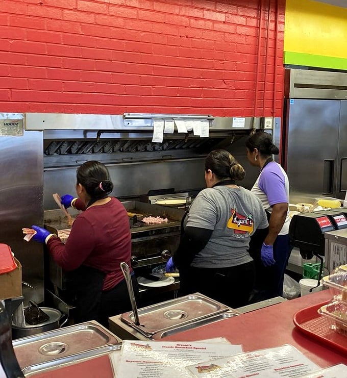The hardworking kitchen crew making breakfast magic happen one order at a time.