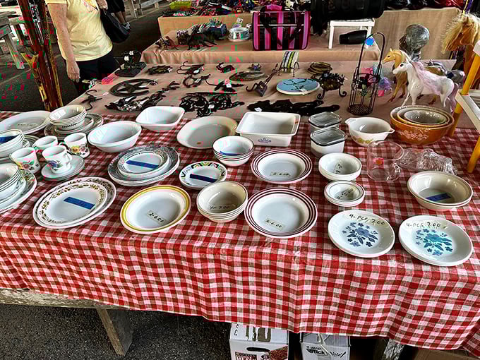 Vintage dishware arranged on classic red-checkered tablecloths&mdash;grandma's kitchen reincarnated and priced to sell.