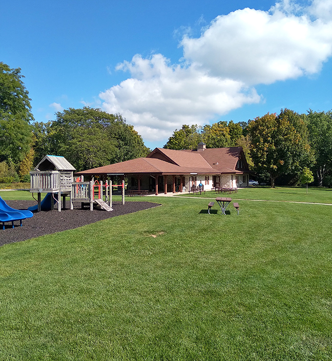 This park pavilion and playground represent the heart of community life, where generations gather for everything from picnics to profound conversations.