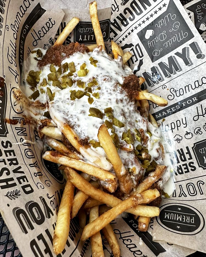 Loaded fries that blur the line between side dish and main event—a glorious mess of cheese, chili, and pure indulgence.