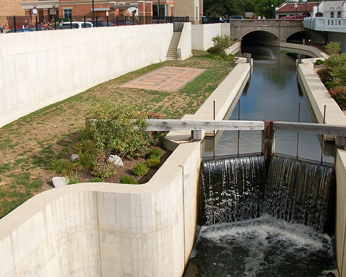 The historic canal lock system stands as a testament to engineering ingenuity, now serving as both functional waterway and living history lesson.